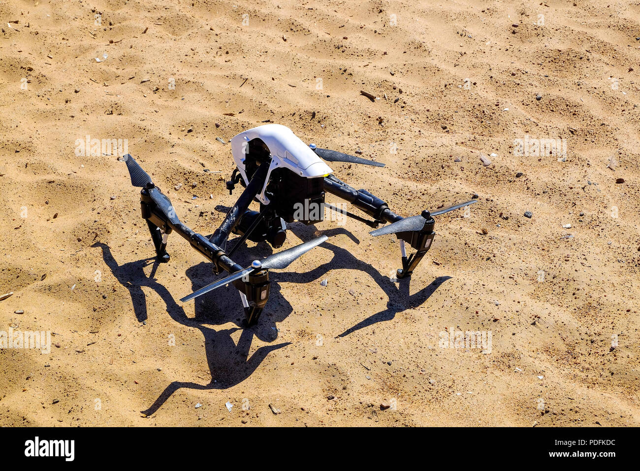 Aircraft quadcopter, drone with high quality video camera. Standing on ...