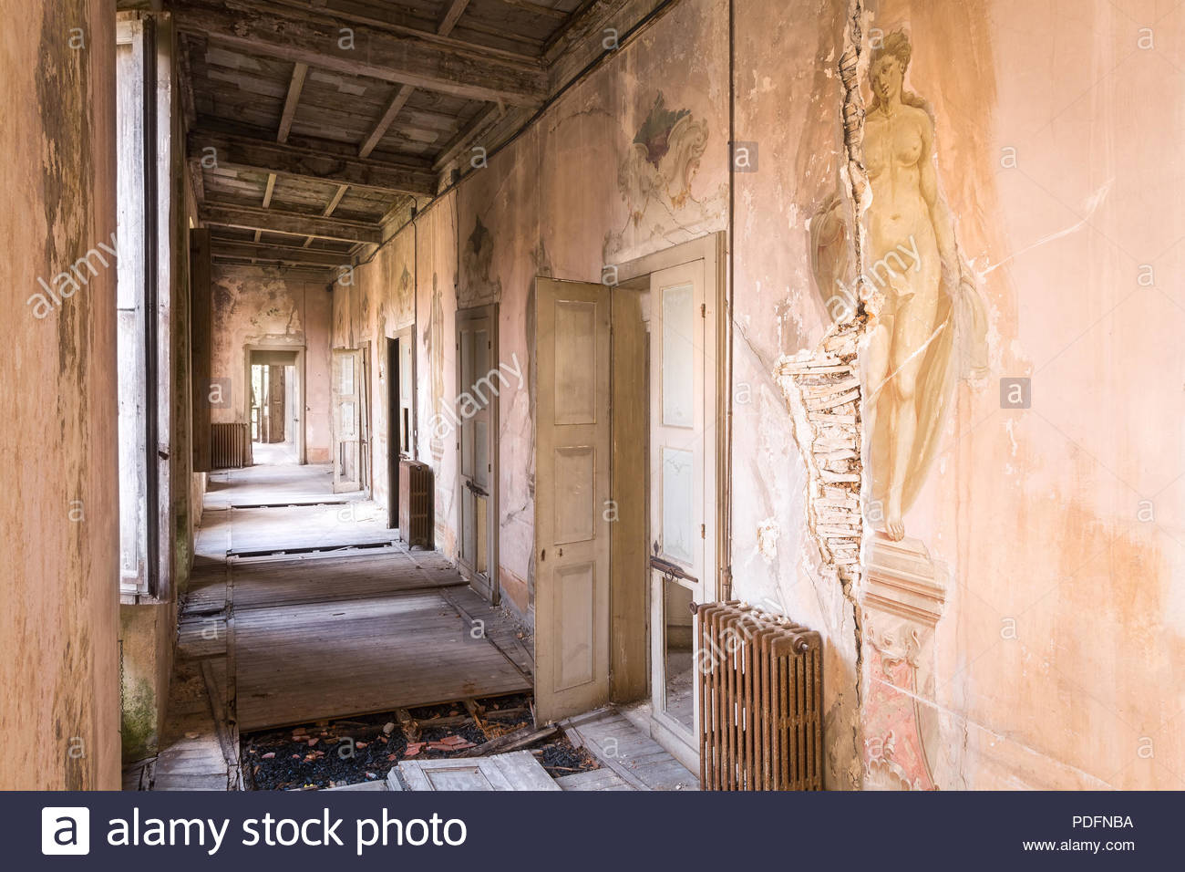 Decaying interior of an abandoned building with peeling paint and ...