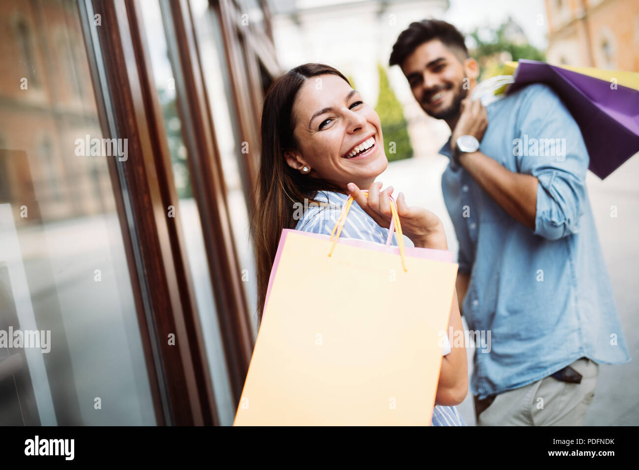 Happy attractive loving couple enjoy shopping together Stock Photo - Alamy