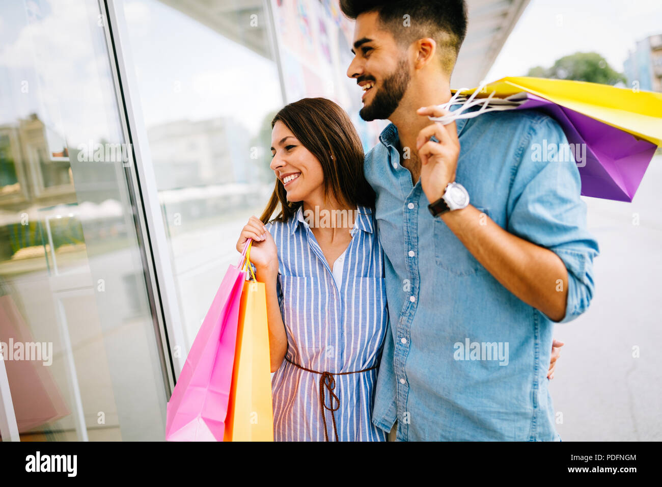 Happy attractive loving couple enjoy shopping together Stock Photo - Alamy