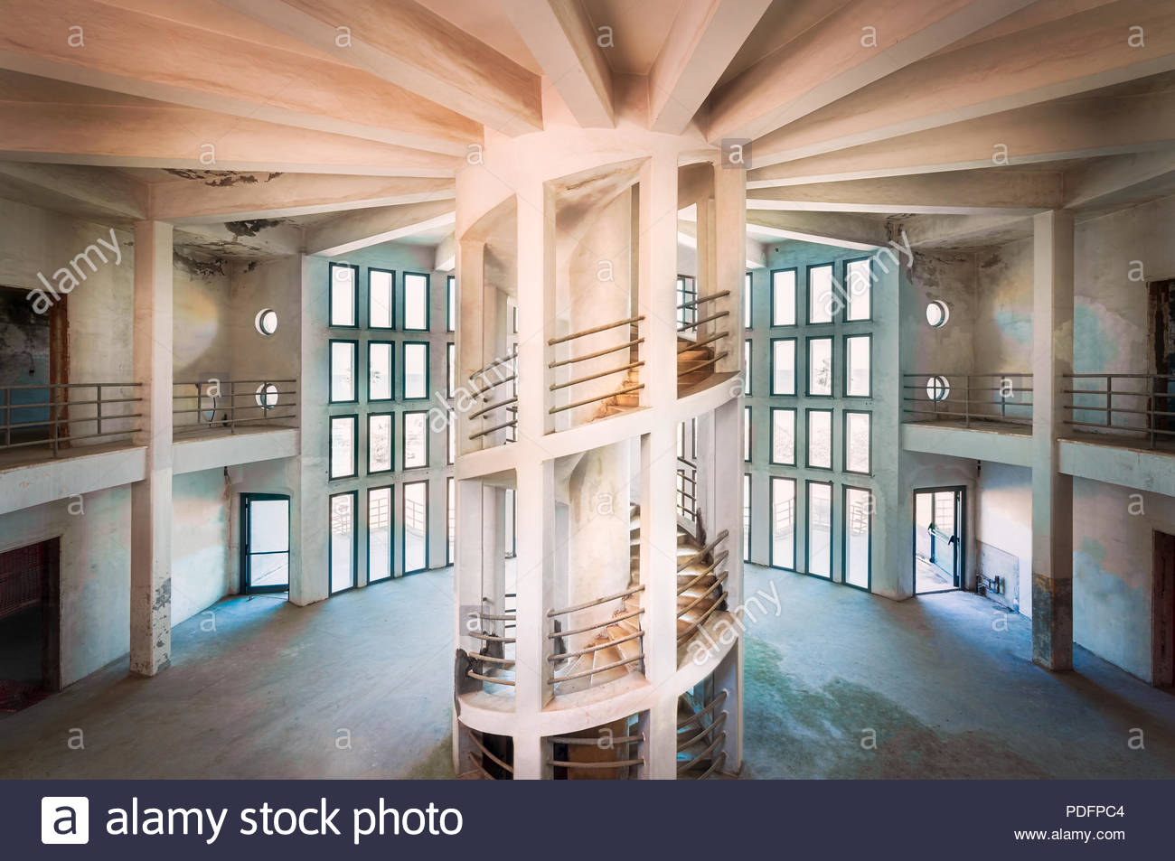 Decaying interior of an abandoned building with peeling paint and ...