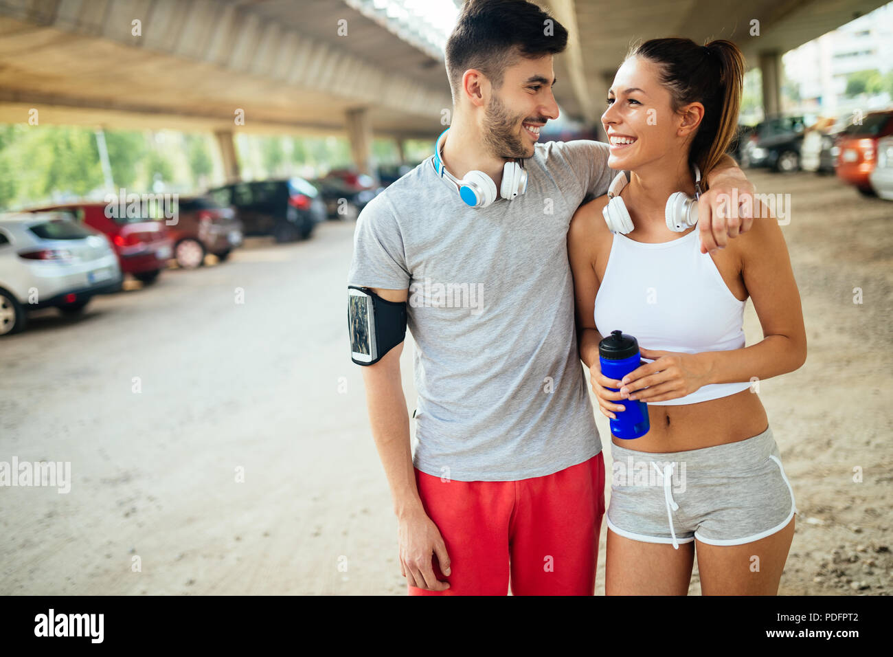 Couple jogging outdoors Stock Photo - Alamy