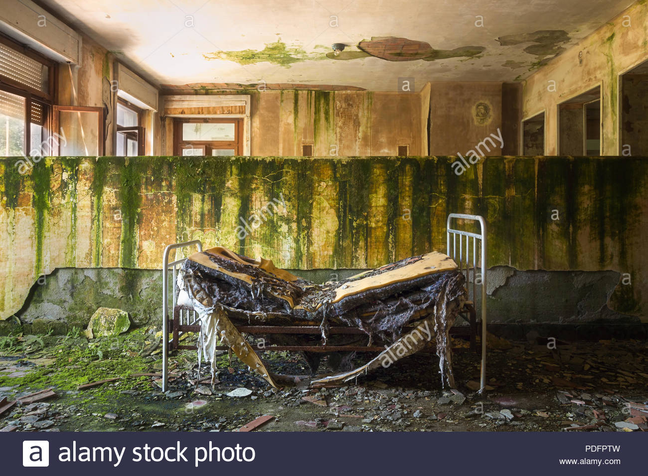 Decaying interior of an abandoned building with peeling paint and ...
