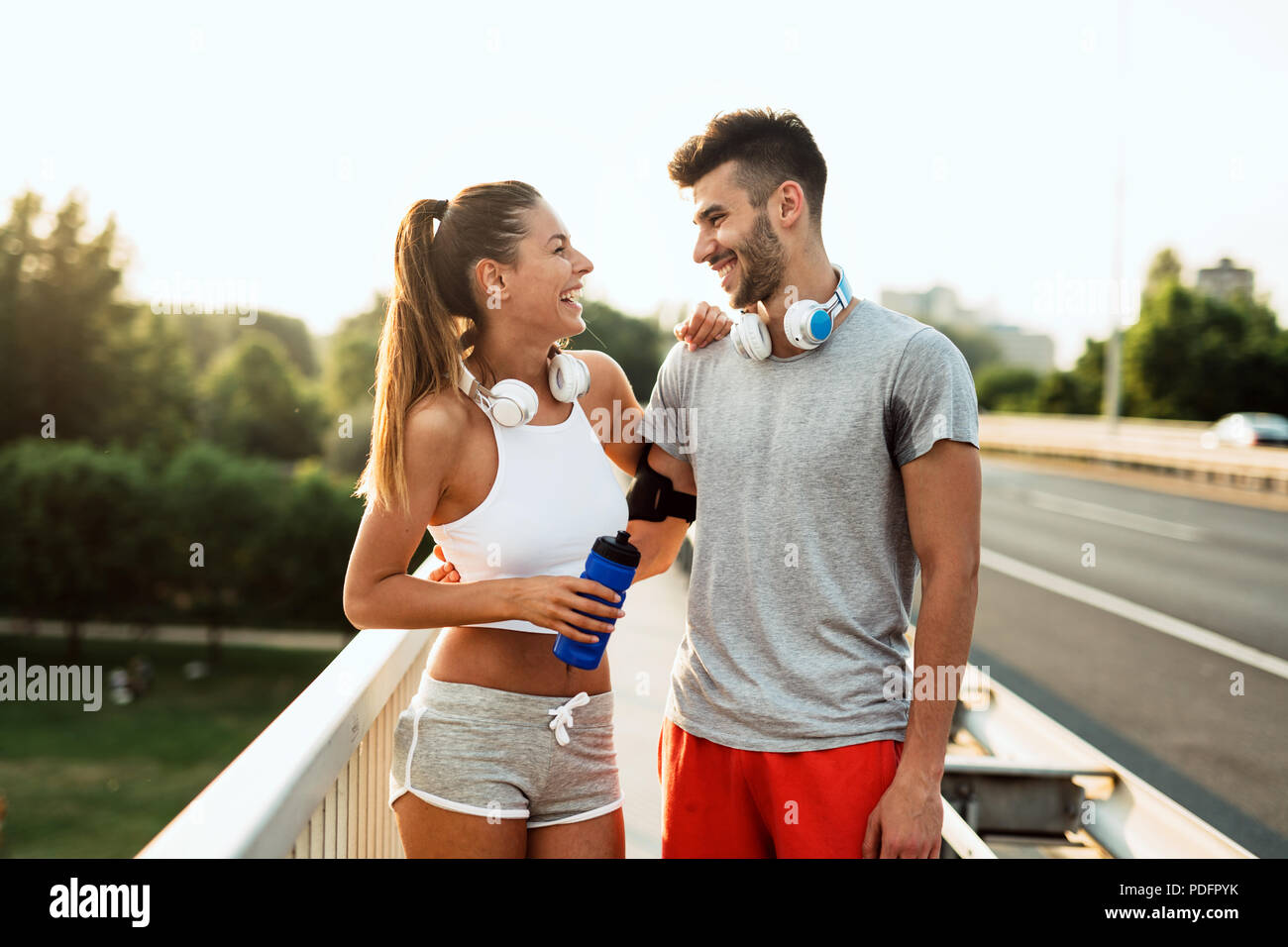 Couple jogging outdoors Stock Photo - Alamy