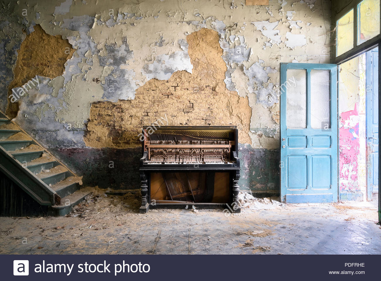 Decaying interior of an abandoned building with peeling paint and ...