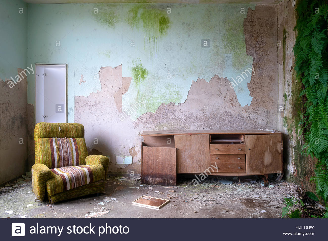 Decaying interior of an abandoned building with peeling paint and ...