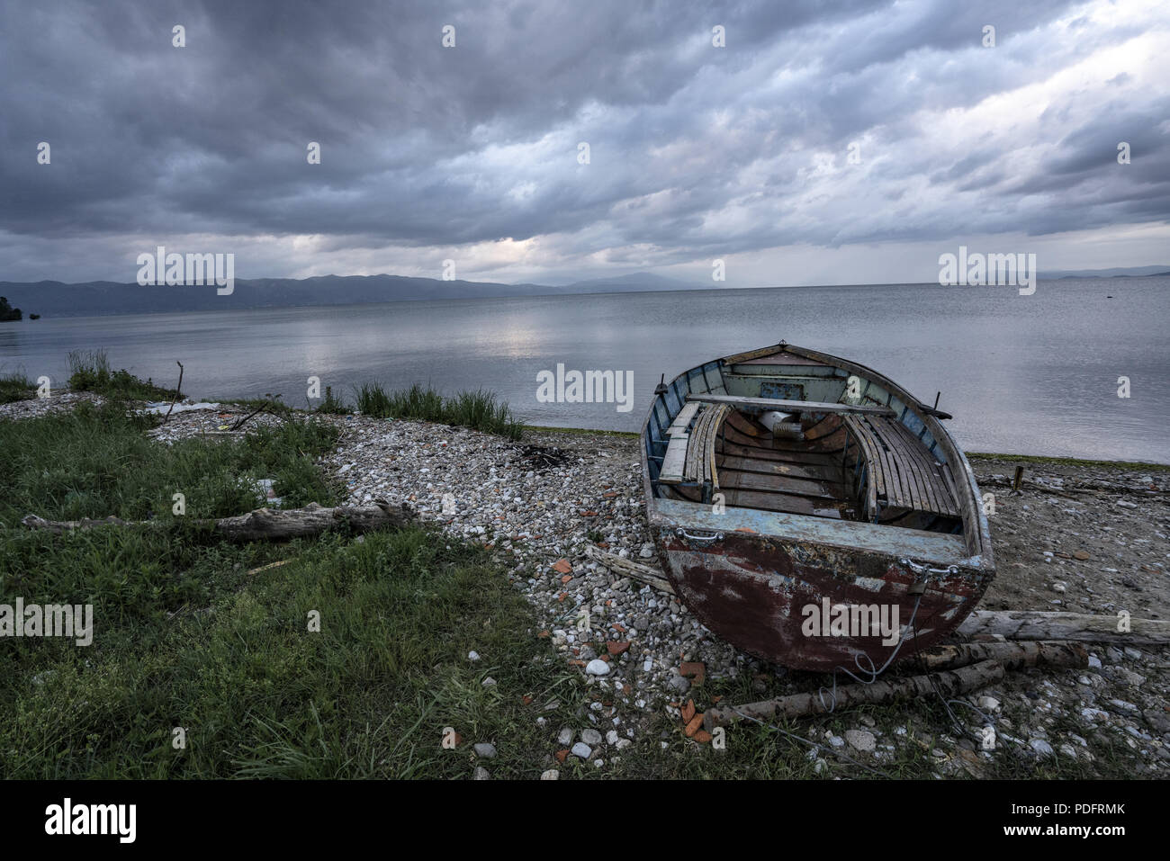 Lake Ohrid landscapes and Boat washed on beach Stock Photo - Alamy