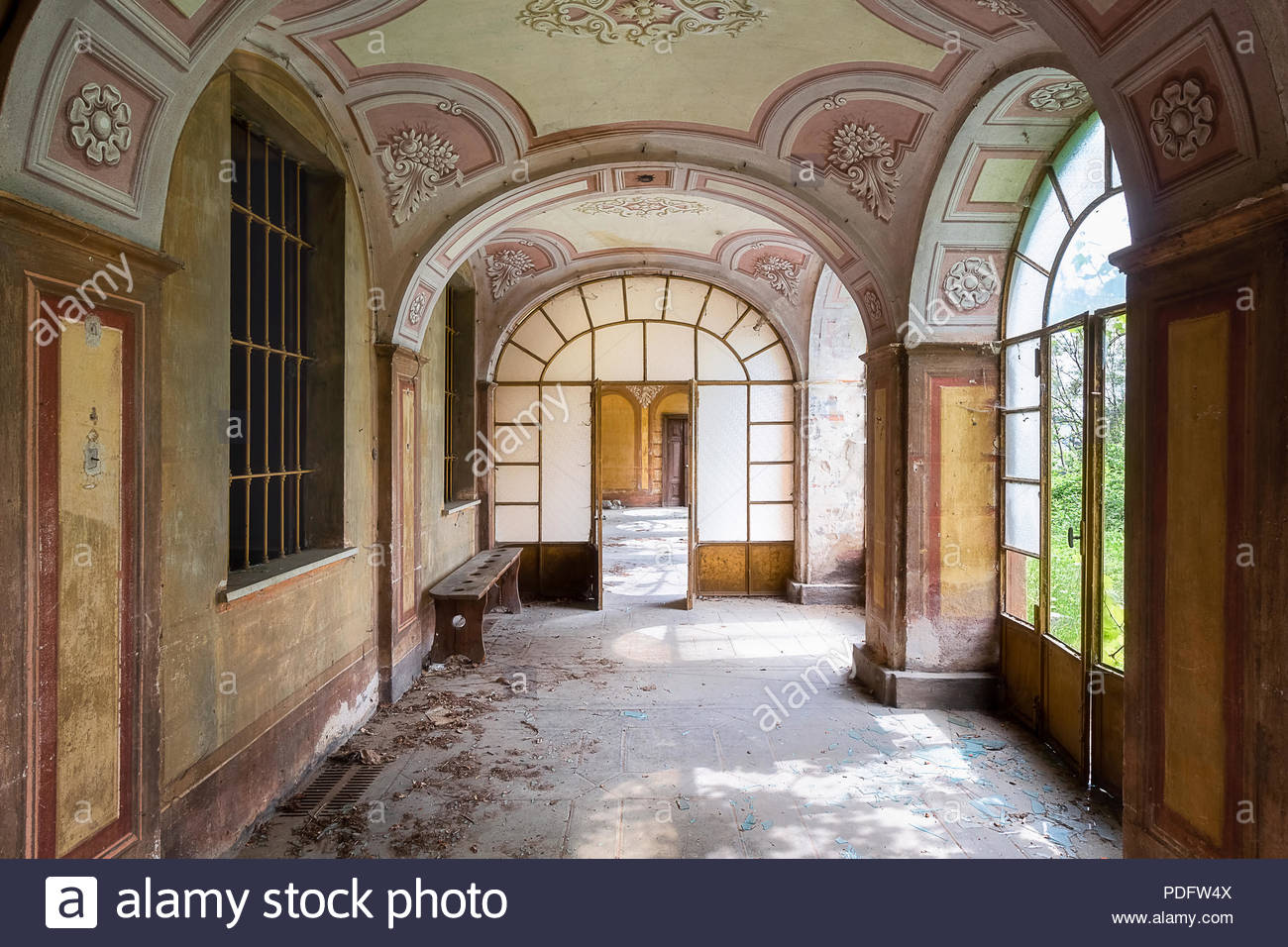 Decaying interior of an abandoned building with peeling paint and ...