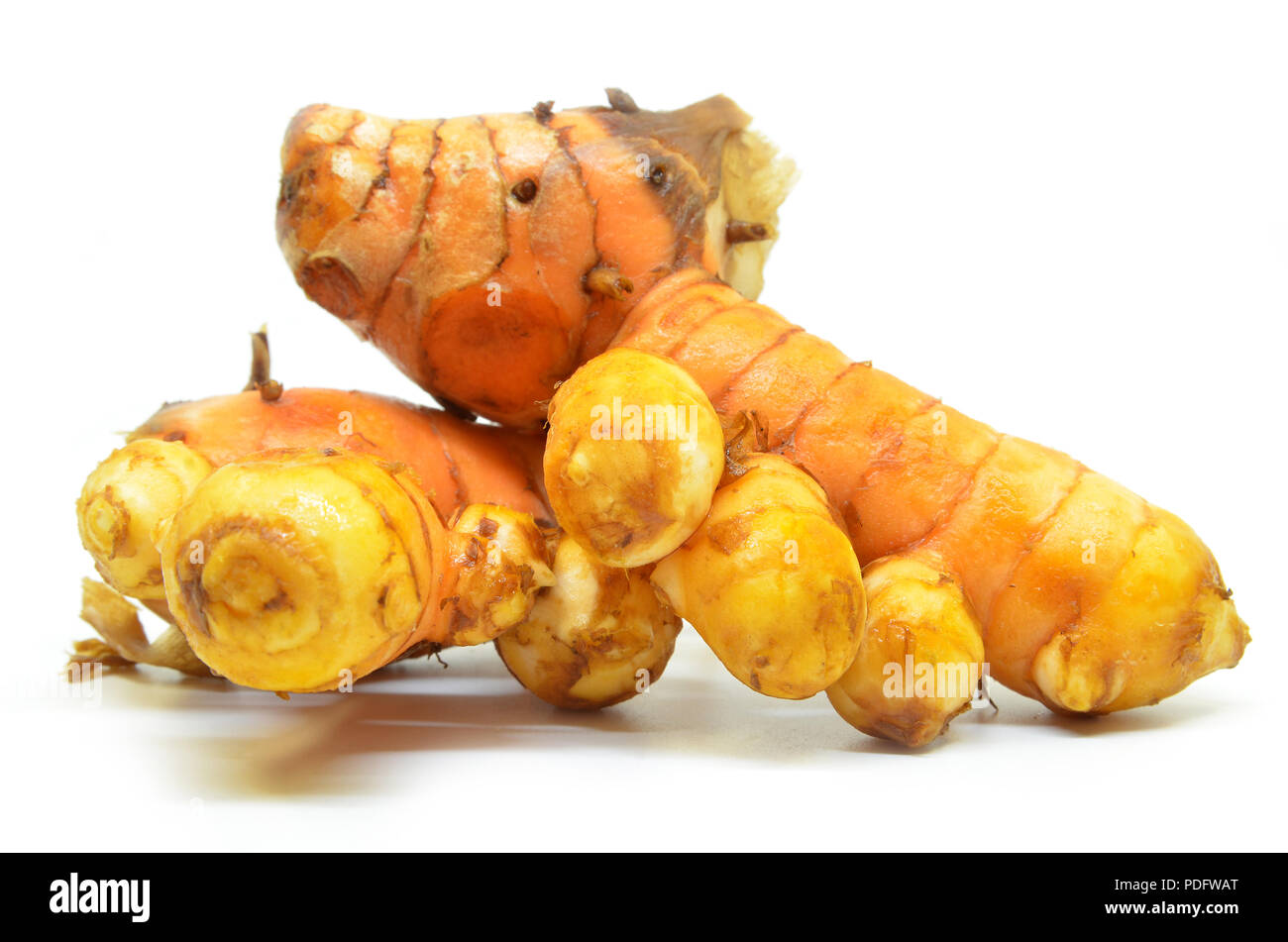 Fresh turmeric root isolated on white background Stock Photo - Alamy