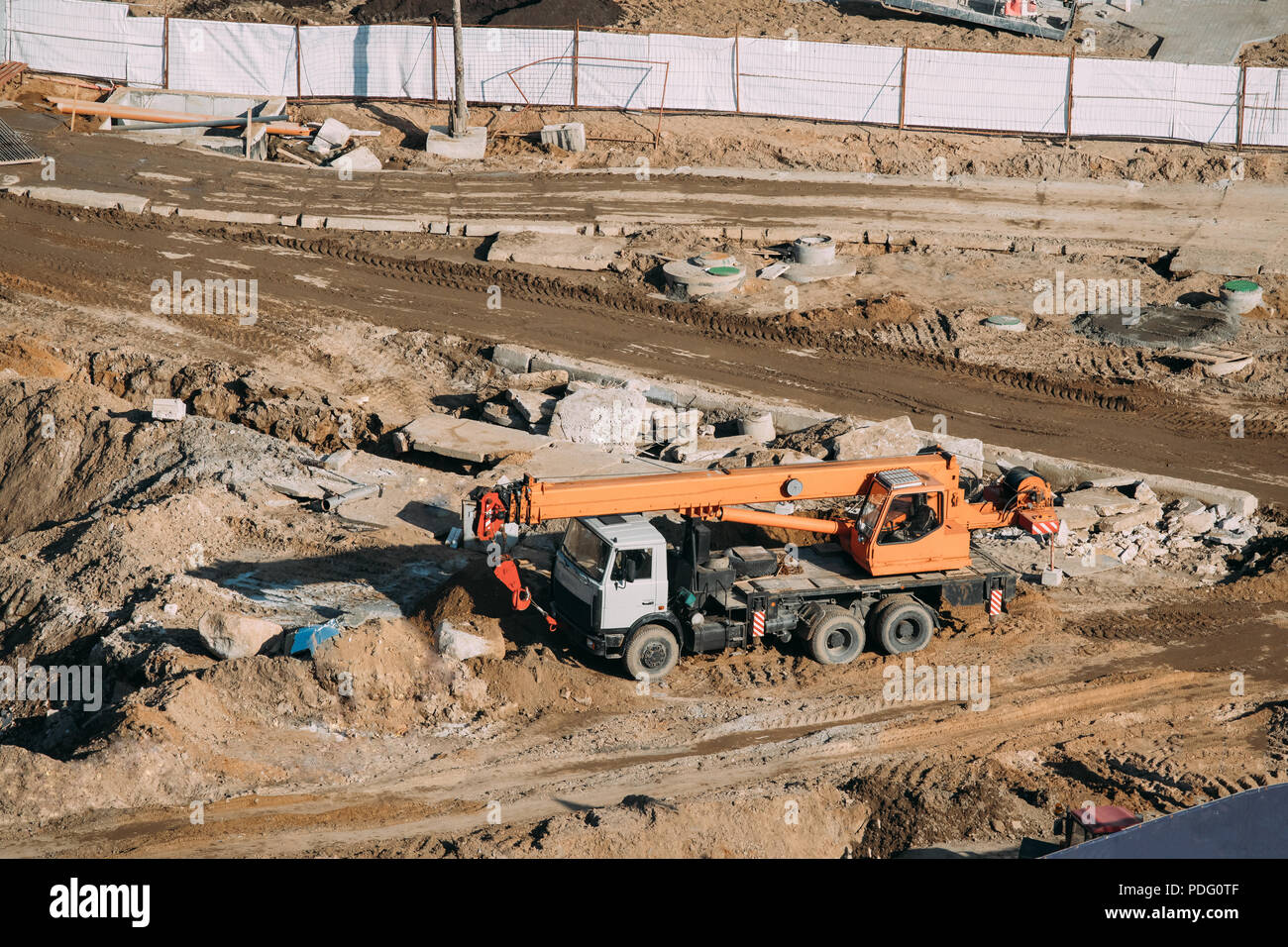 Mobile Crane Of Jib Type On City Building Site. Construction Of Houses ...