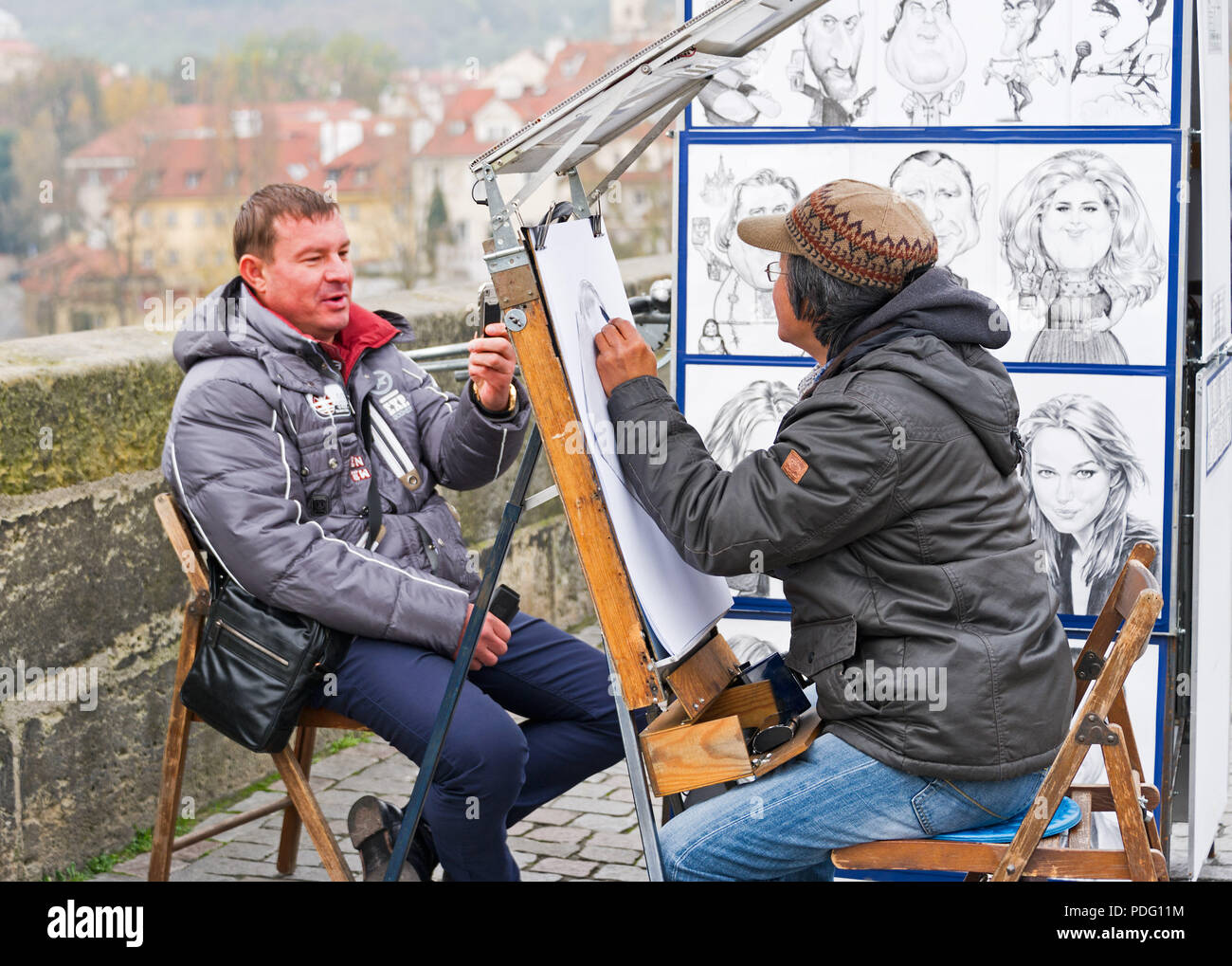 Street Caricature Artist at work on the Charles Bridge Prague Czech ...