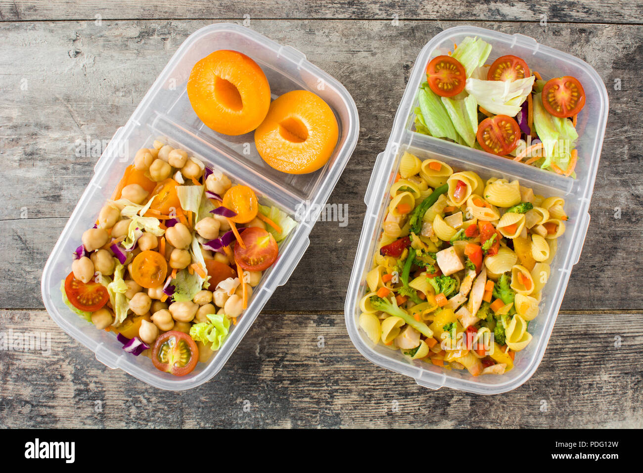 Lunch box with healthy food ready to eat on wooden table. Top view ...