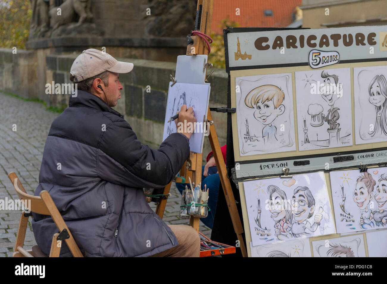 Street Caricature Artist at work on the Charles Bridge Prague Czech ...