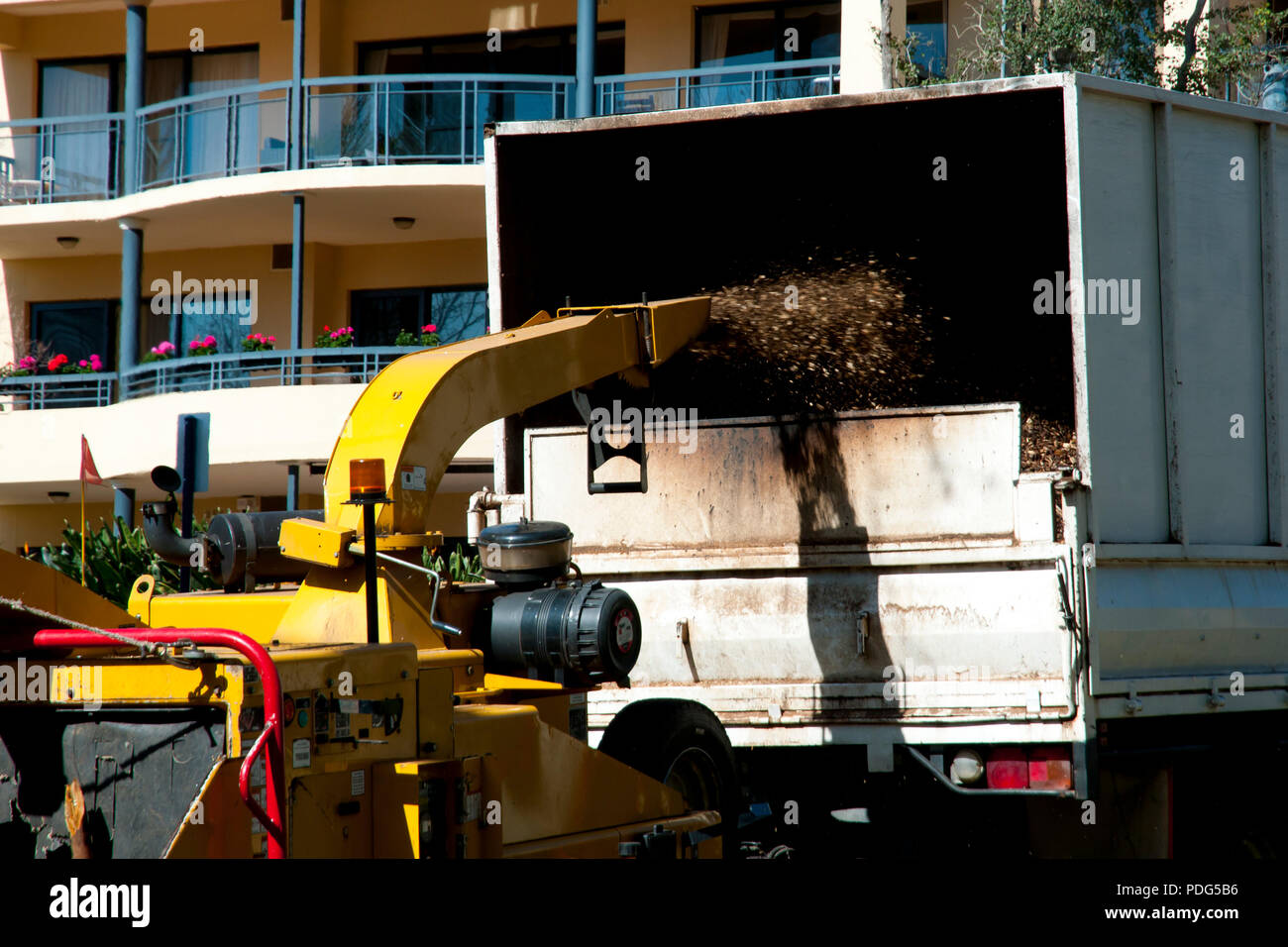 Wood tree branch chipper shredding hi-res stock photography and images ...