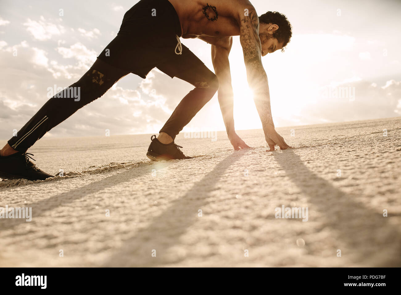 Fit young man in starting position ready for running. Athlete ready to ...