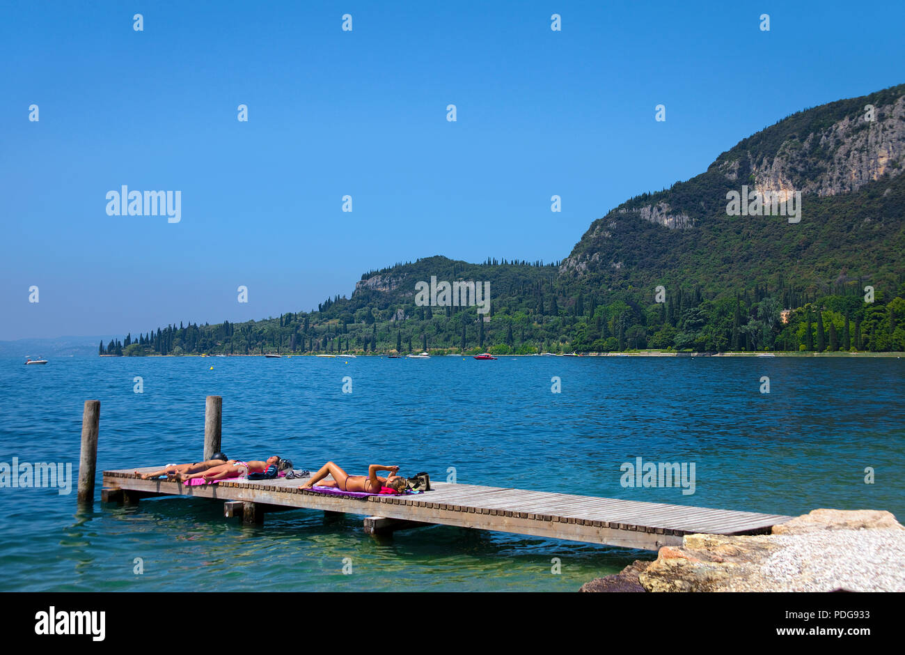 Girls sunbathing by the lake hi-res stock photography and images - Alamy