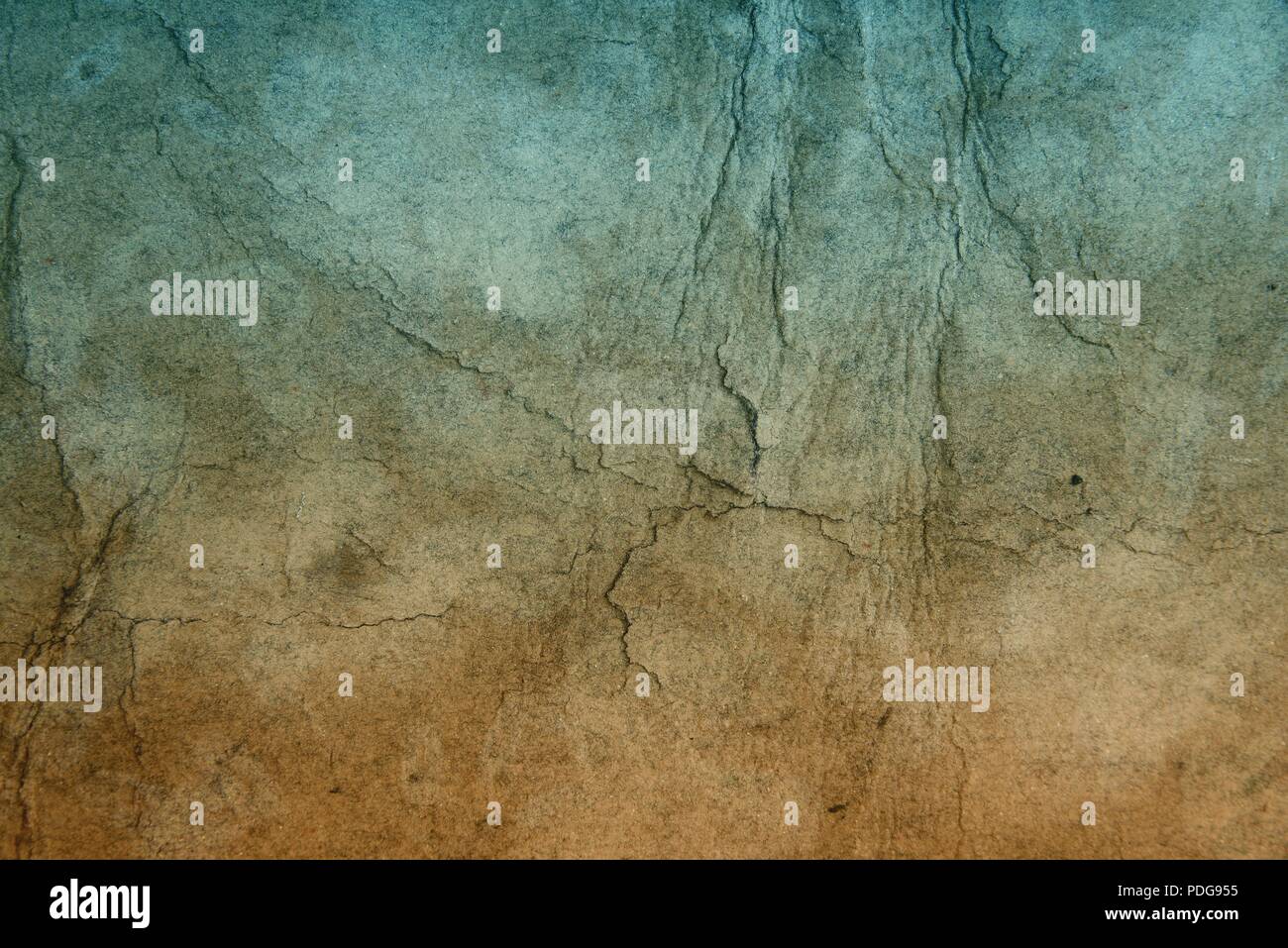 Old hard cracked paper background in dark colors Stock Photo - Alamy
