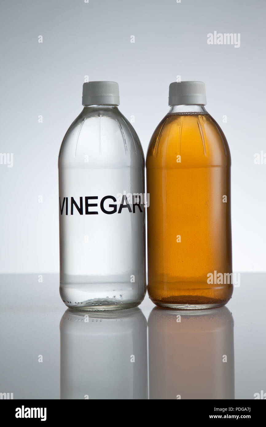 white vinegar and apple cider vinegar on white background Stock Photo ...