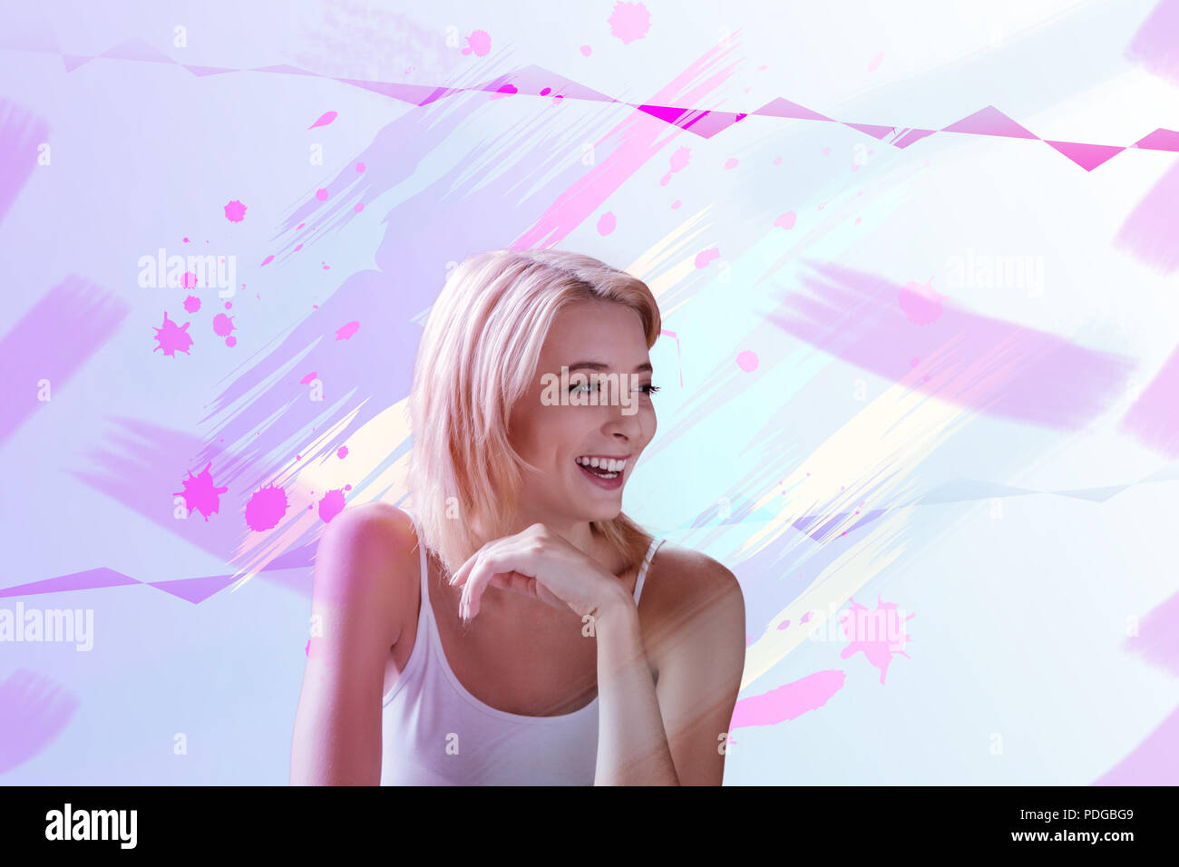 Talented artist sitting in her studio and laughing Stock Photo - Alamy