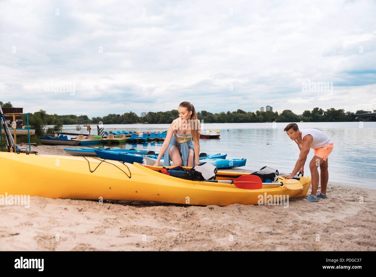 Cute loving couple getting ready for memorable river adventure Stock ...