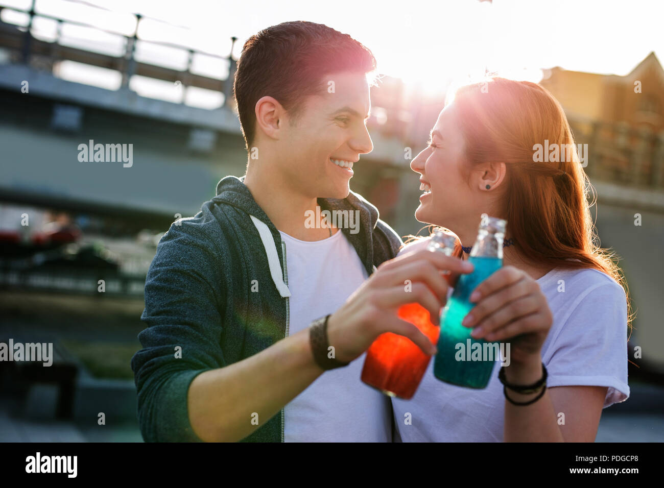 Nice happy couple cheering with drinks Sweet memories Stock Photo - Alamy