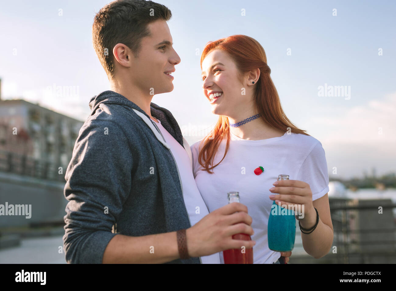 Positive joyful couple talking to each other Stock Photo - Alamy