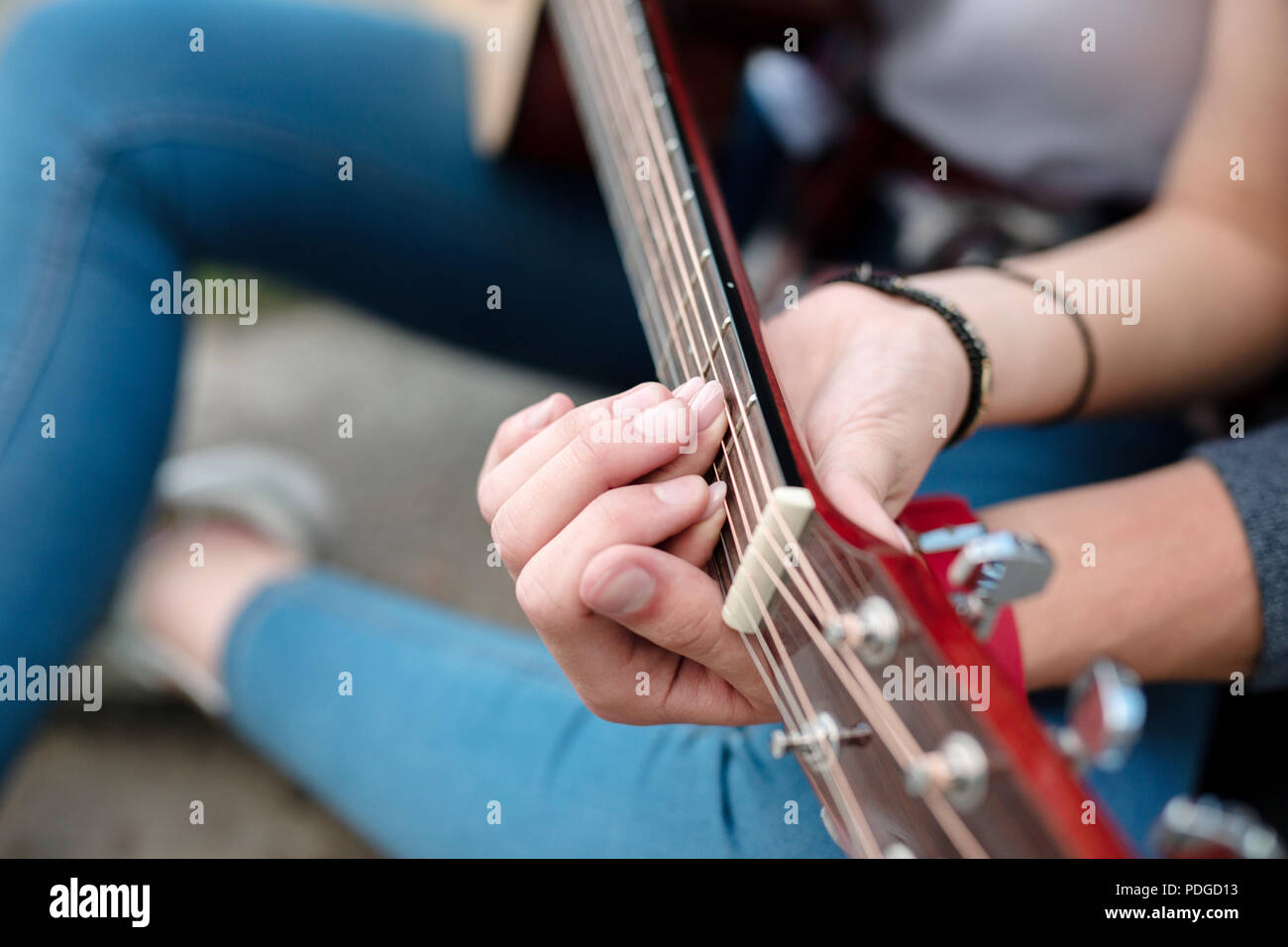 Young man close guitar outside hi-res stock photography and images - Alamy