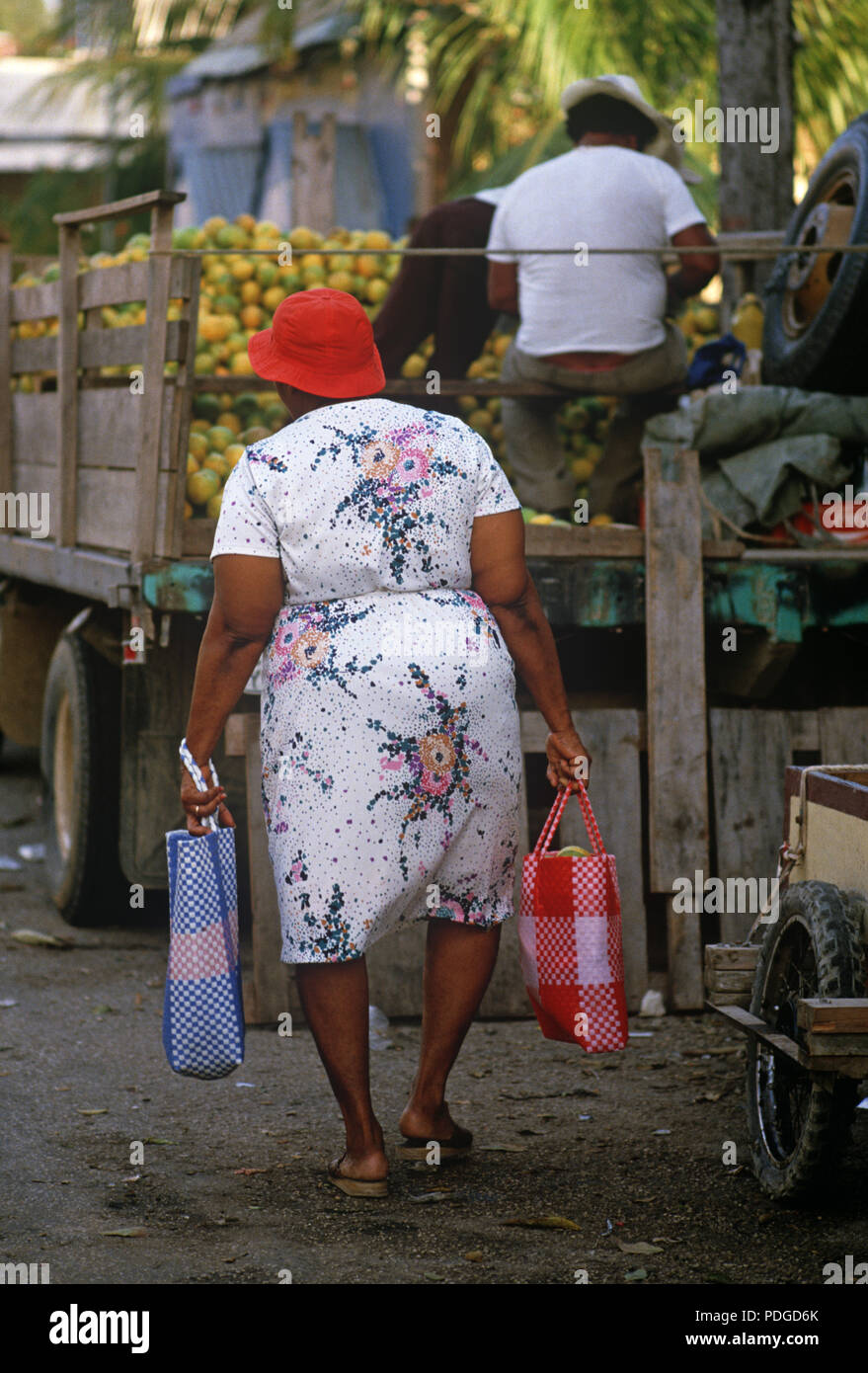 Belizean lady with red hat in Belize City fruit and vegetable market ...