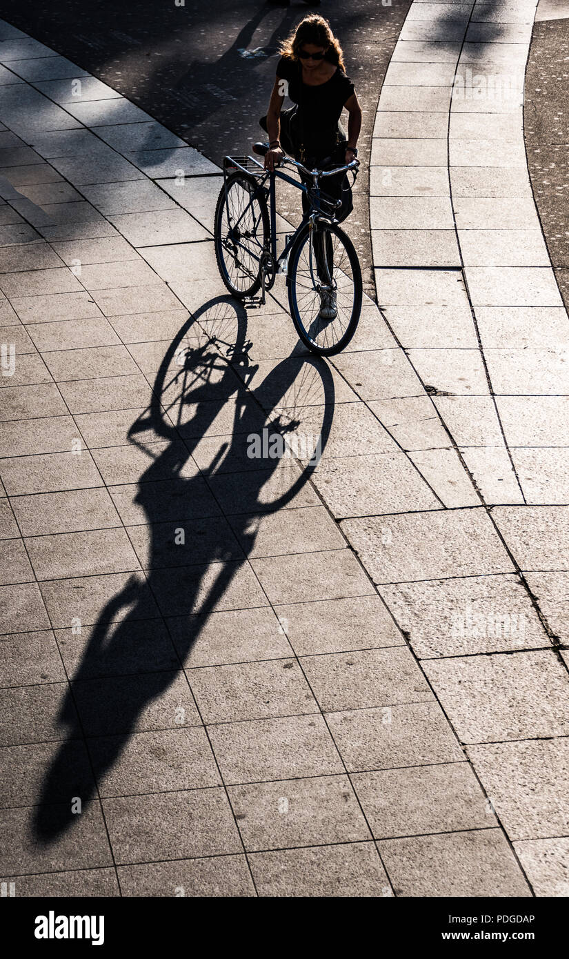Shadow girl riding bike hi-res stock photography and images - Alamy