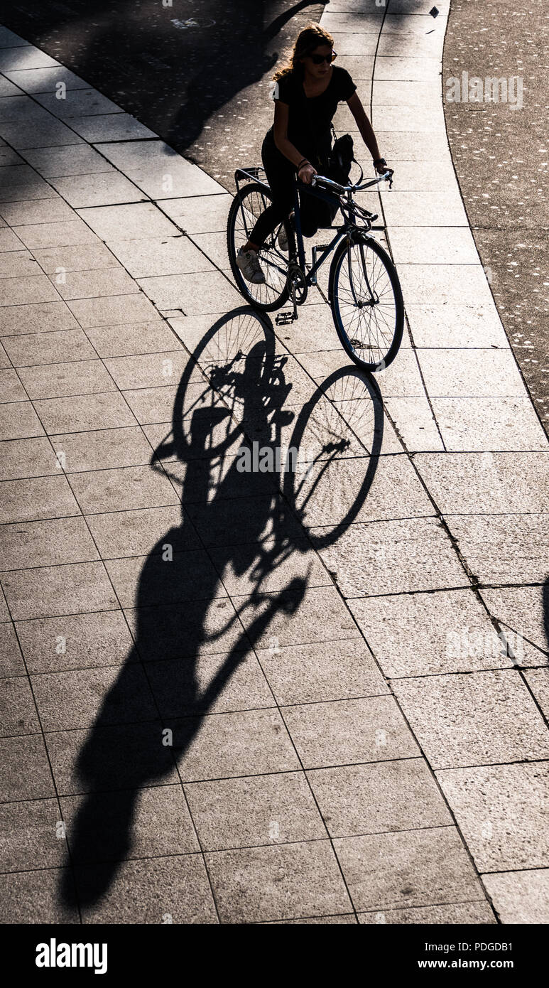 Shadow girl riding bike hi-res stock photography and images - Alamy