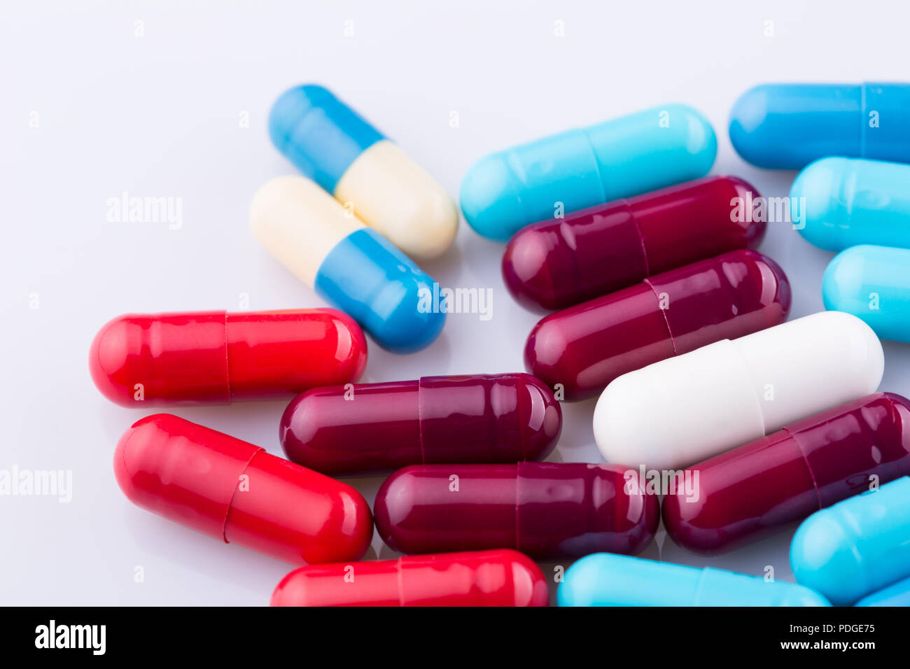Tablets pills capsule heap mix therapy drugs, over a white background ...
