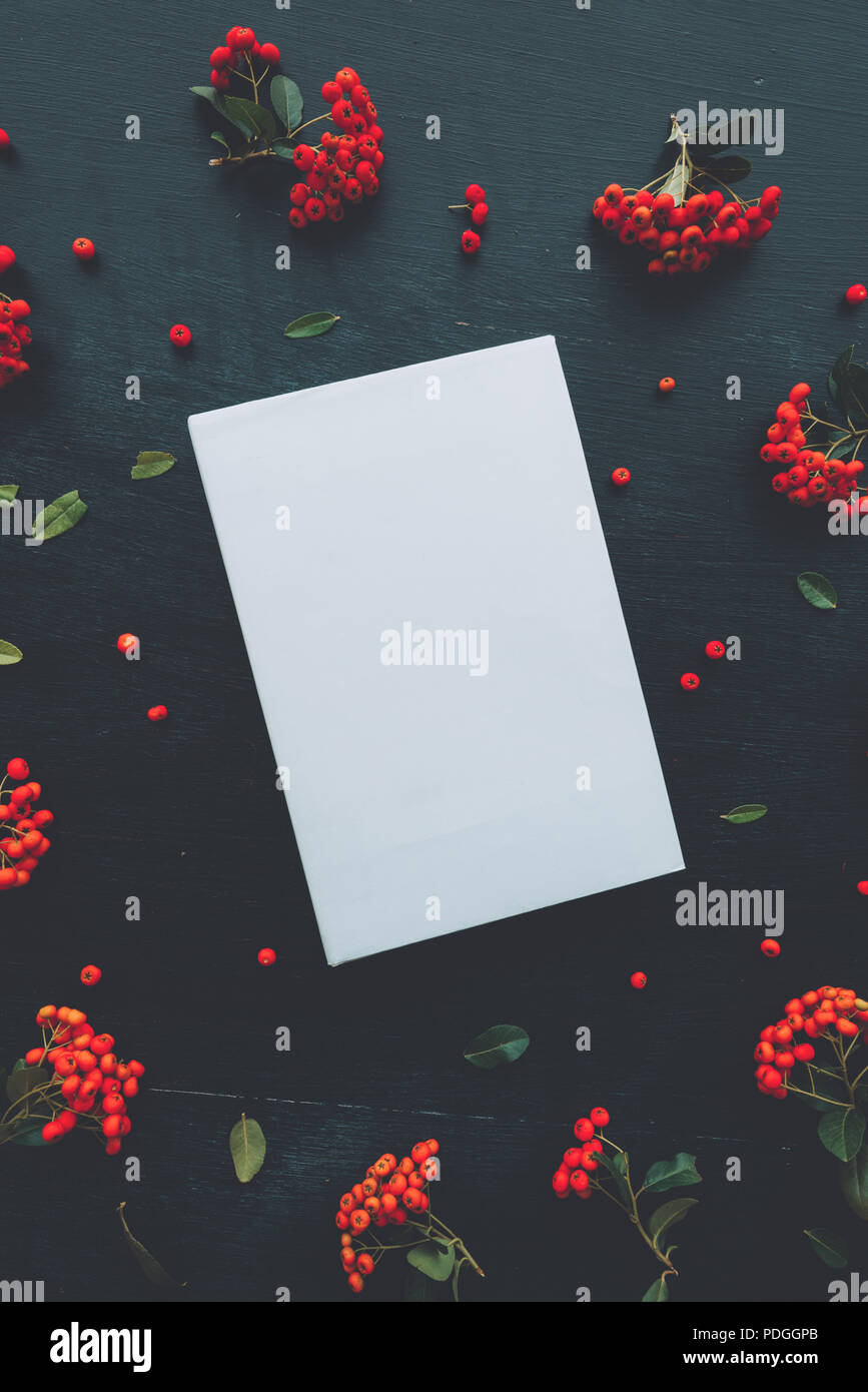 Hardcover book cover design mock up top view overhead shot with floral ...