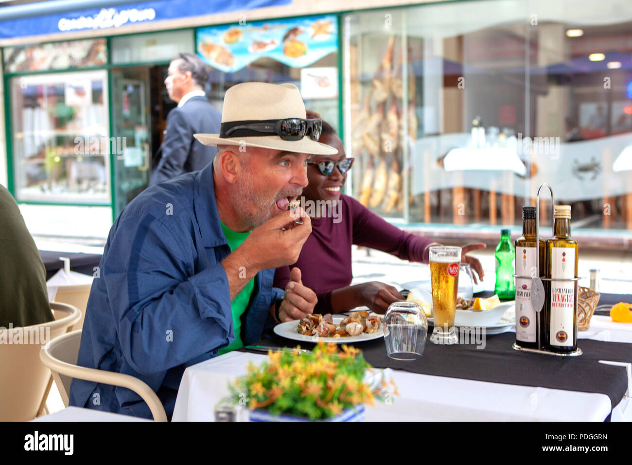 Man eating fish at restaurant hi-res stock photography and images - Alamy