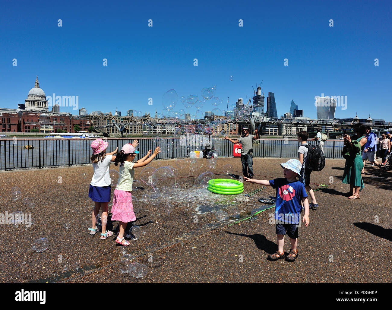 Children having fun with bubbles, Southbank, London, England, UK Stock ...
