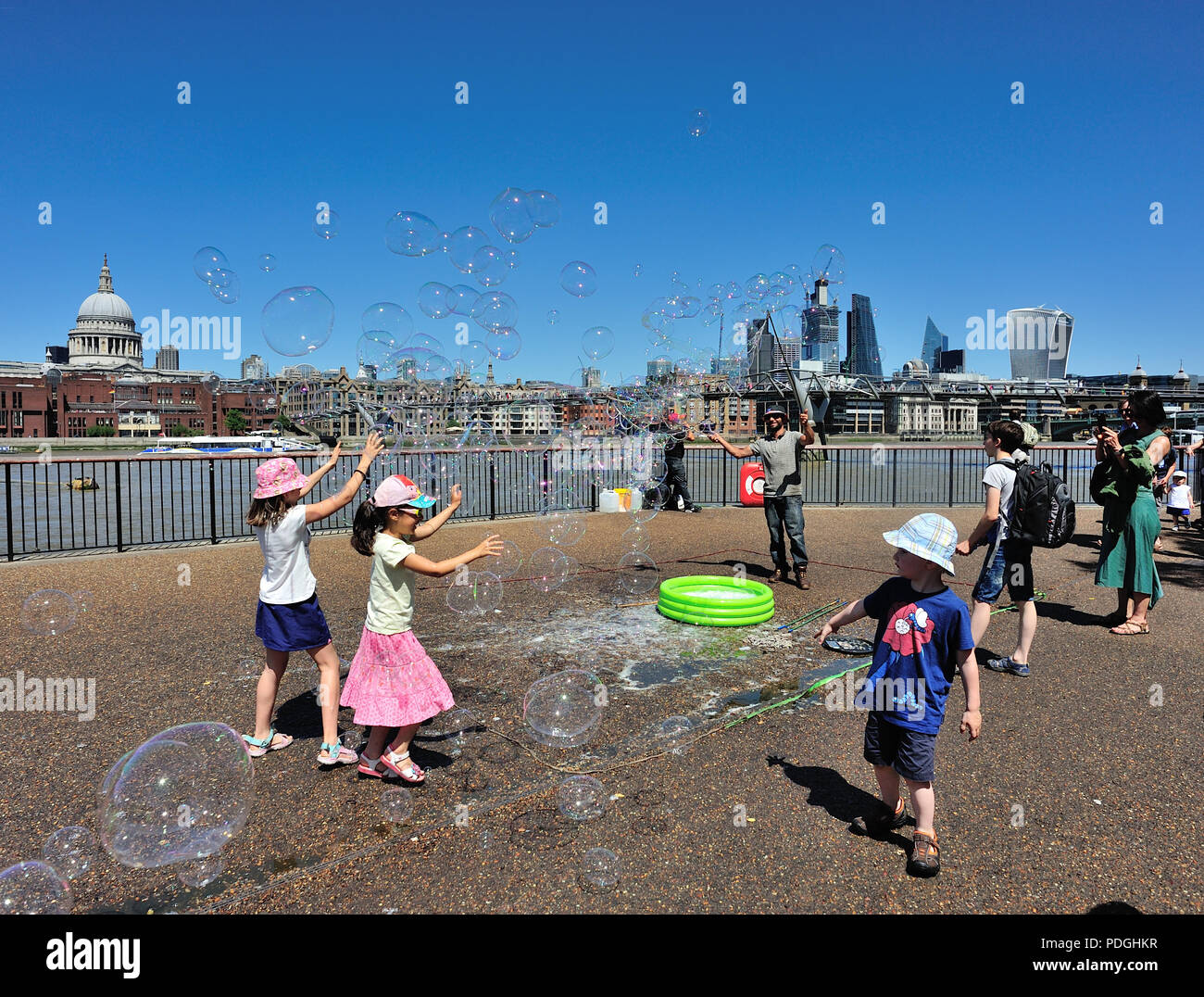Children having fun with bubbles, Southbank, London, England, UK Stock ...