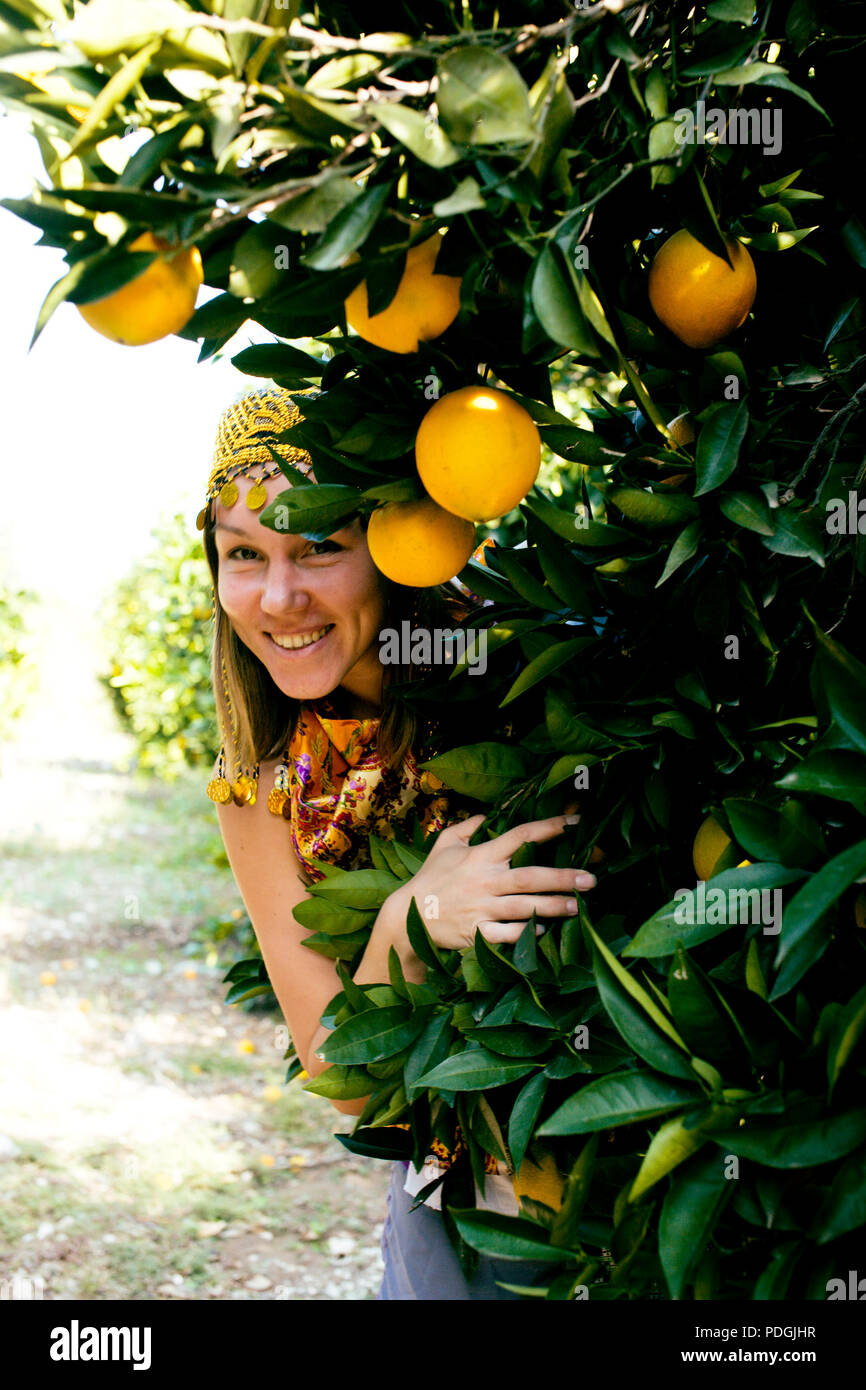 pretty islam woman in orange grove smiling, real muslim girl che Stock ...