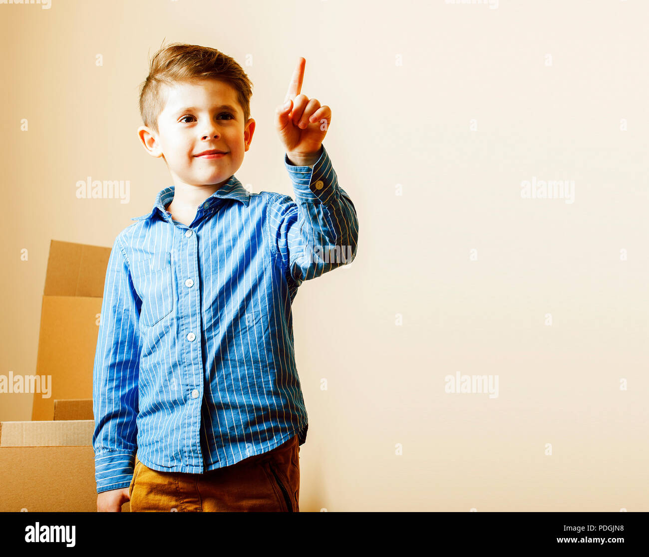 little cute boy in empty room, remoove to new house. home alone Stock ...