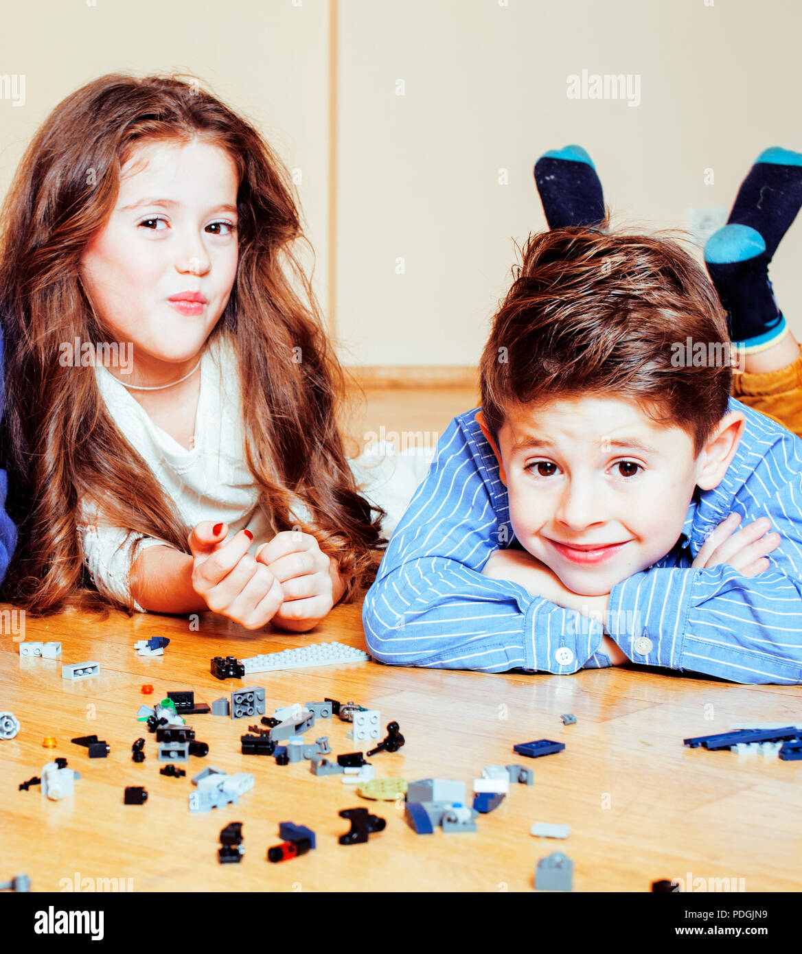 funny cute children playing toys at home, boys and girl smiling Stock ...