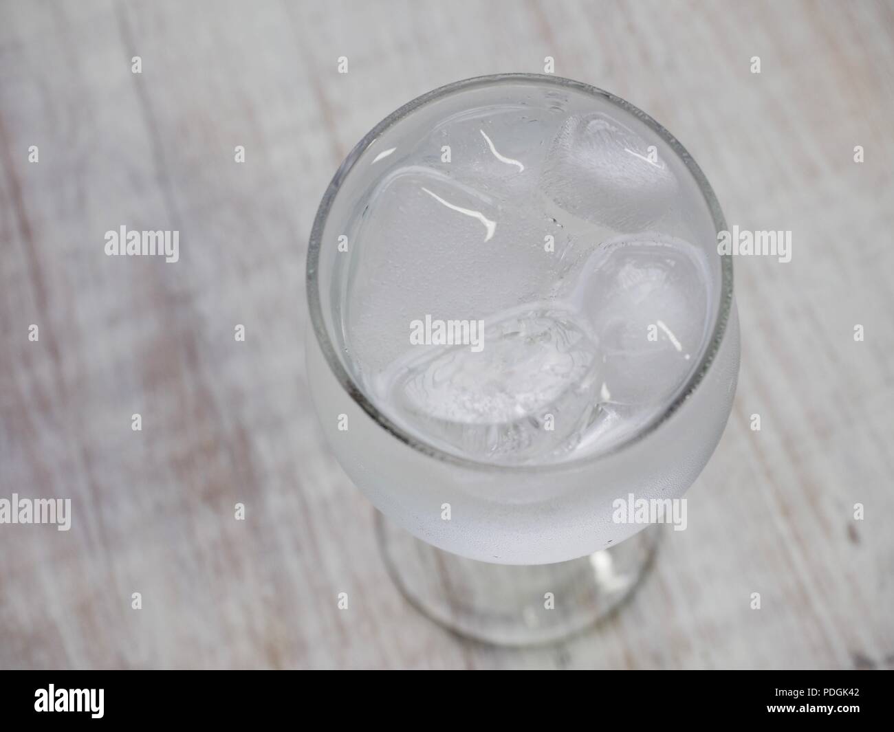 Ice water in a glass cup Stock Photo - Alamy