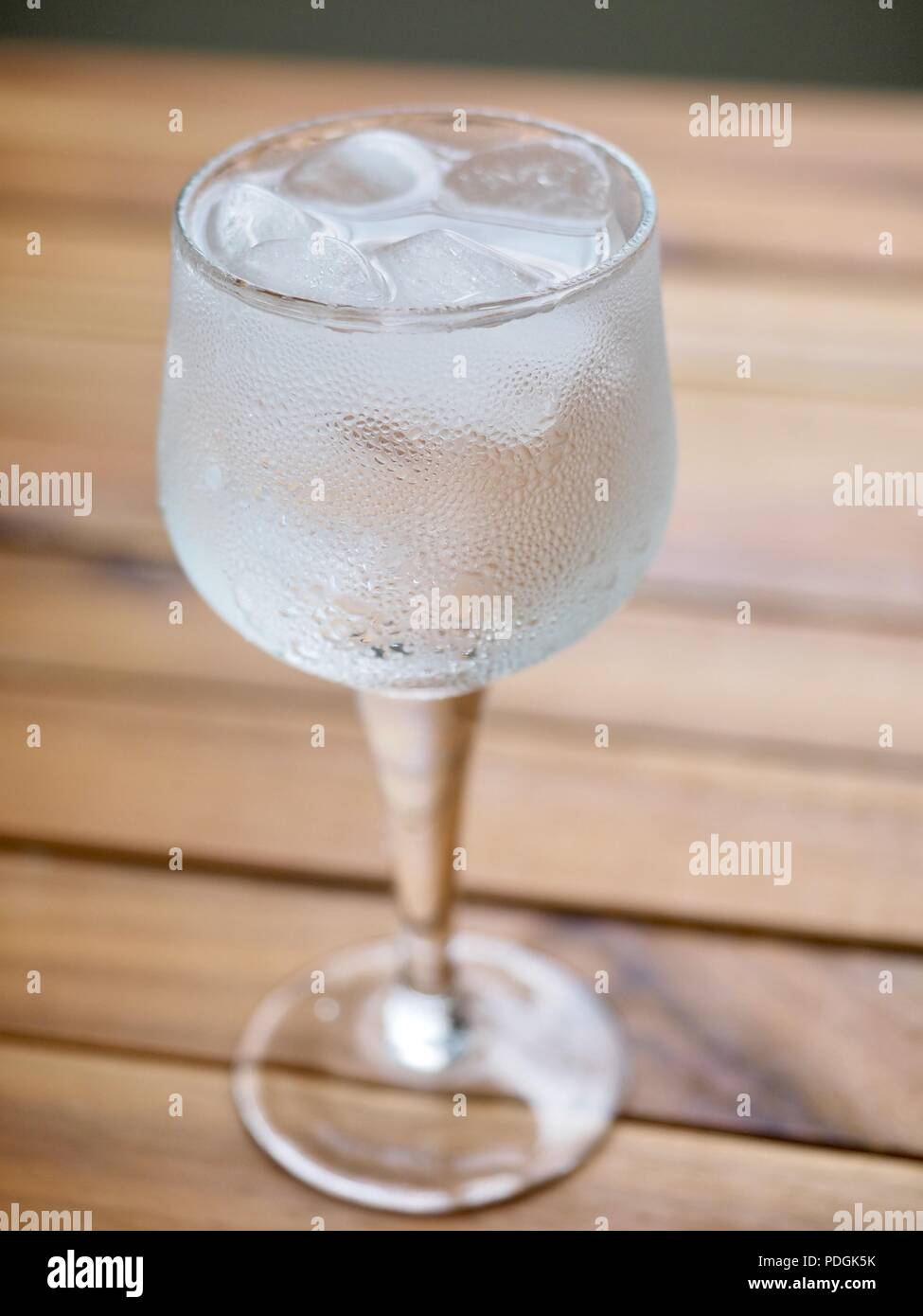 Ice water in a glass cup Stock Photo - Alamy
