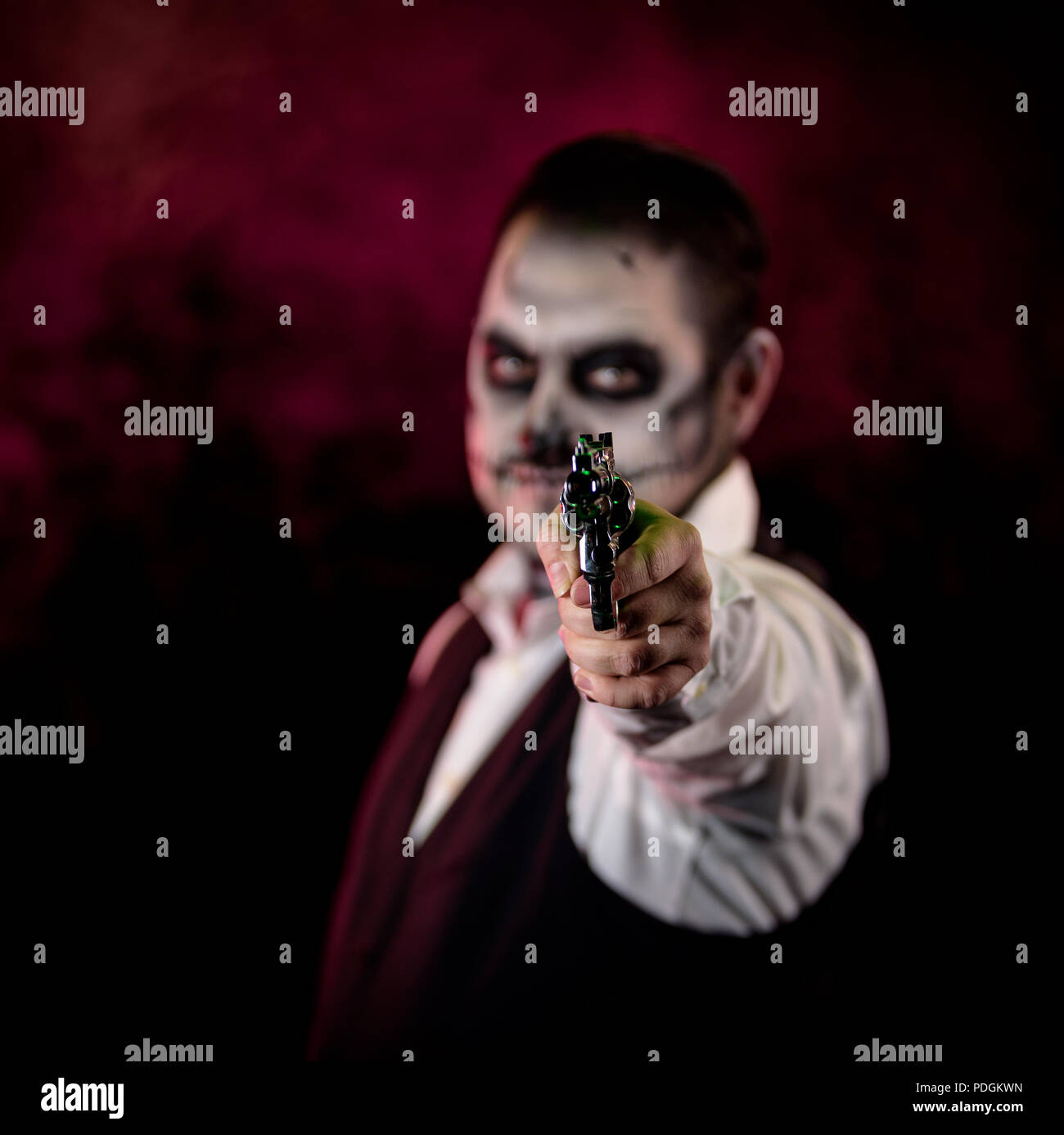 Portrait of a nicely dressed man with skull makeup. Horror and ...