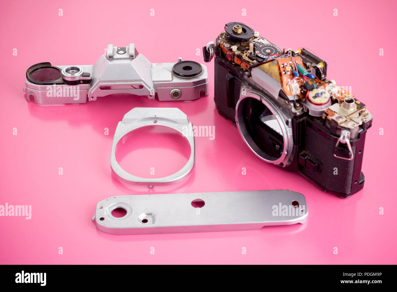 The old film camera washes out the parts on pink background Stock Photo ...