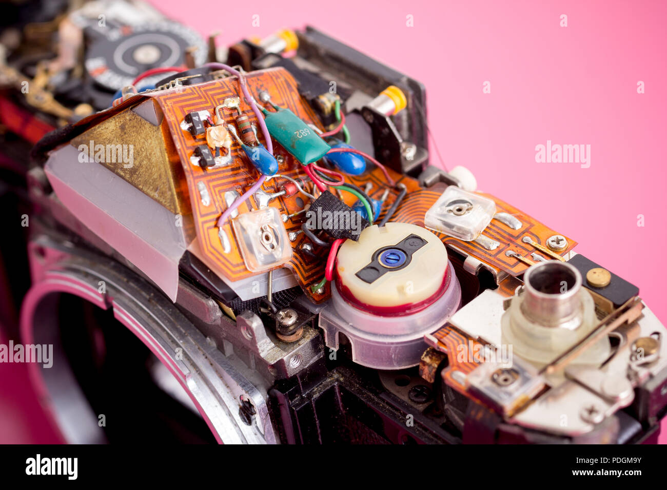 The old film camera washes out the parts on pink background Stock Photo ...