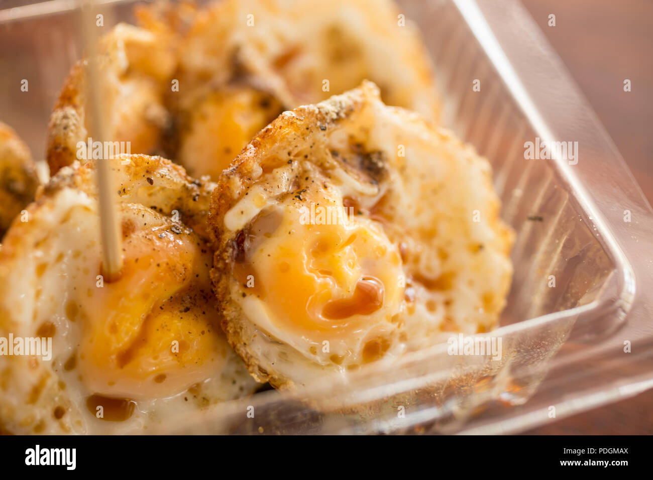 Fried Chicken egg in plastic box Stock Photo - Alamy