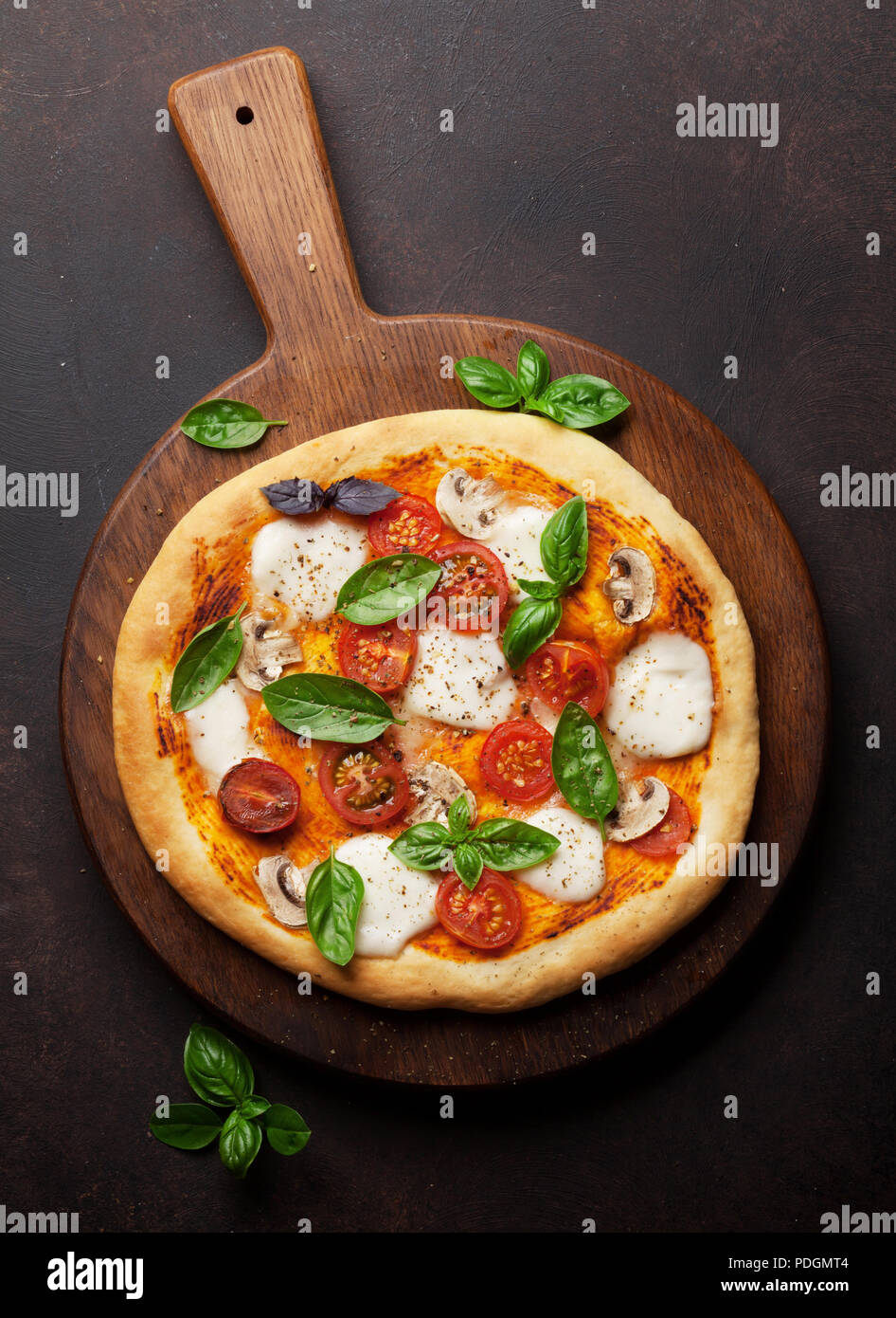 Italian pizza with tomatoes, mozzarella and basil. Top view Stock Photo ...