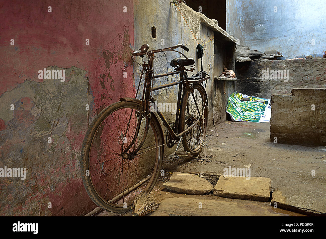 Vintage rusted Indian cycle resting against an old wall Stock Photo - Alamy