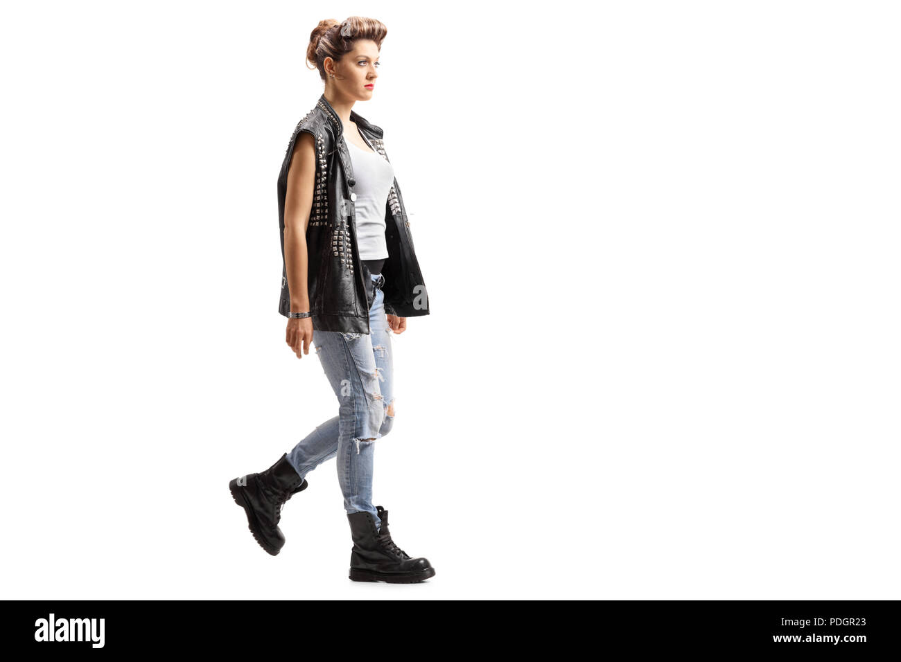 Full length profile shot of a punk girl walking isolated on white ...