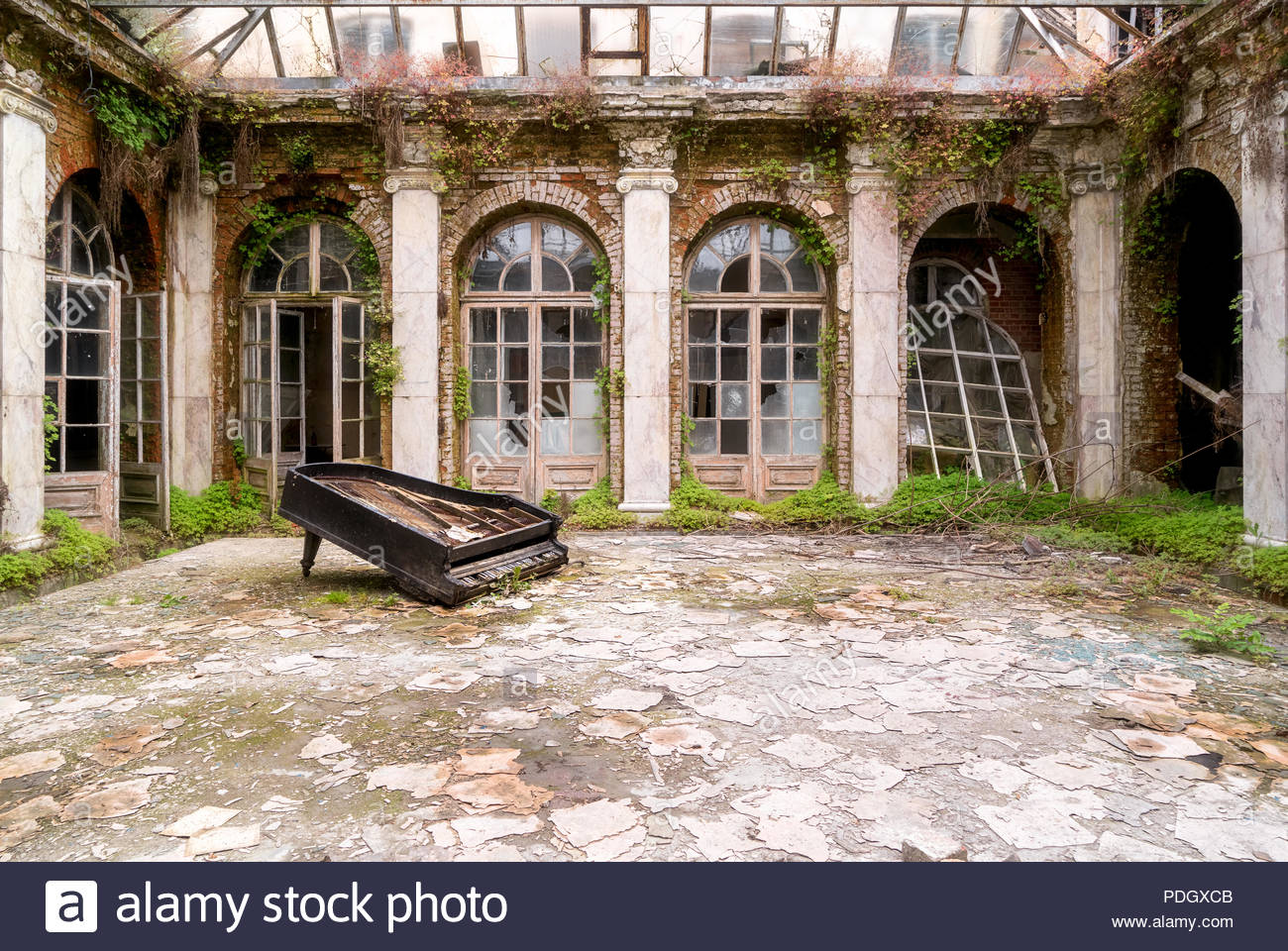 Decaying interior of an abandoned building with peeling paint and ...