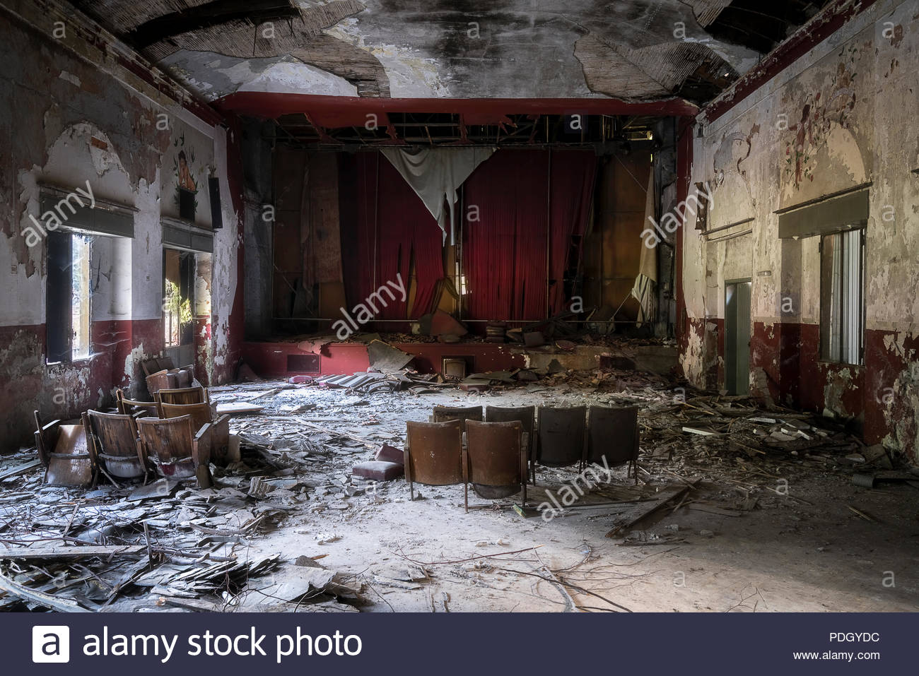 Decaying interior of an abandoned building with peeling paint and ...