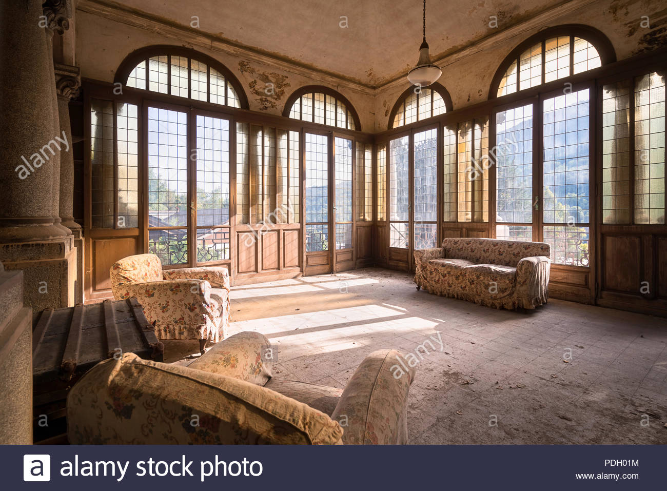 Decaying interior of an abandoned building with peeling paint and ...